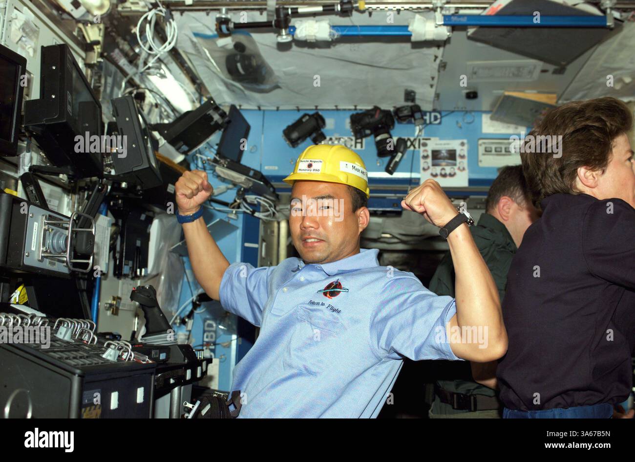 Jul 31, 2005; Atmosphere, Space; Astronaut SOICHI NOGUCHI flexes his ...