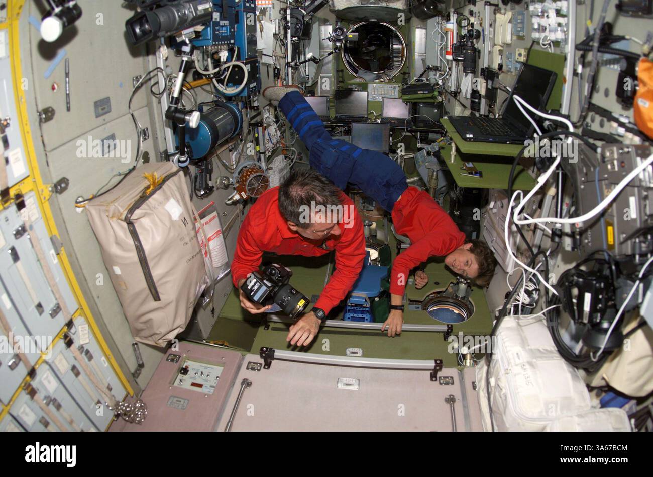 Aug 04, 2005; Astronaut STEPHEN K. ROBINSON (left), STS-114 mission ...