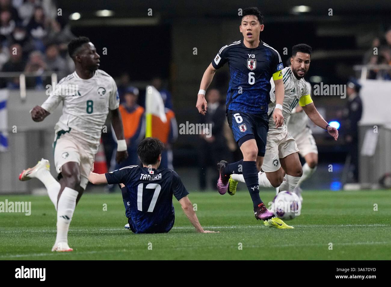Japan's Wataru Endo, right, and Saudi Arabia's Marwan Al Sahafi battle ...