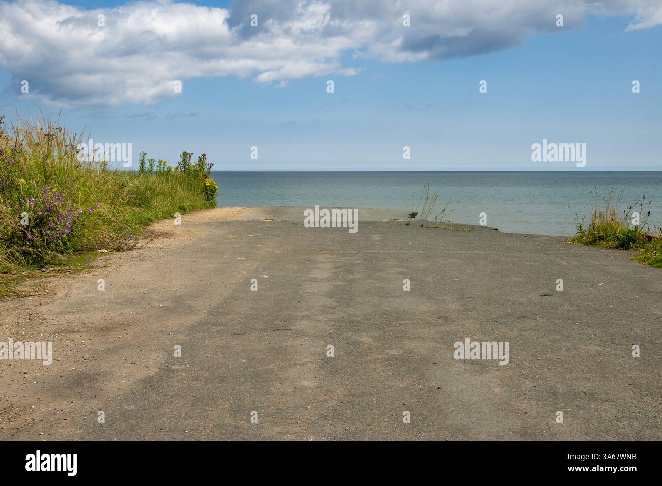 Road collapsed into the sea due to severe coastal erosion. Mill Lane ...