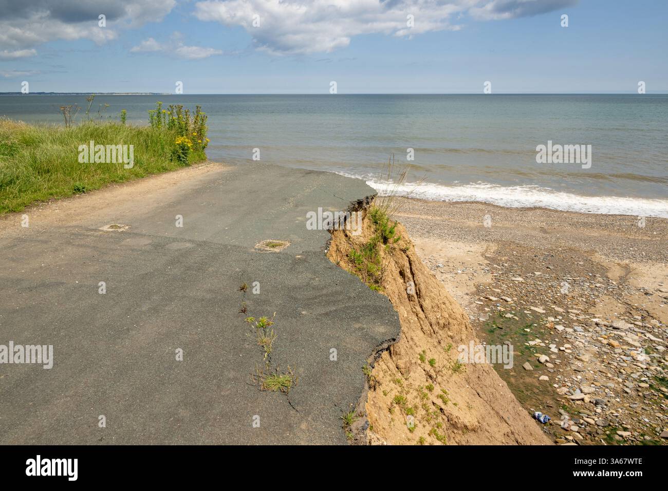 Road collapsed into the sea due to severe coastal erosion. Mill Lane ...