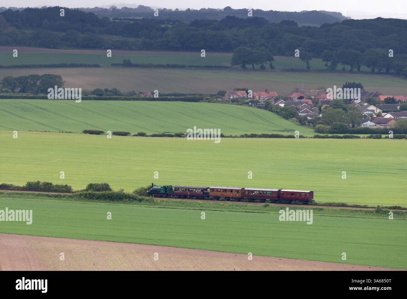 Steam train railway crossing Norfolk fields May 2024 Stock Photo - Alamy