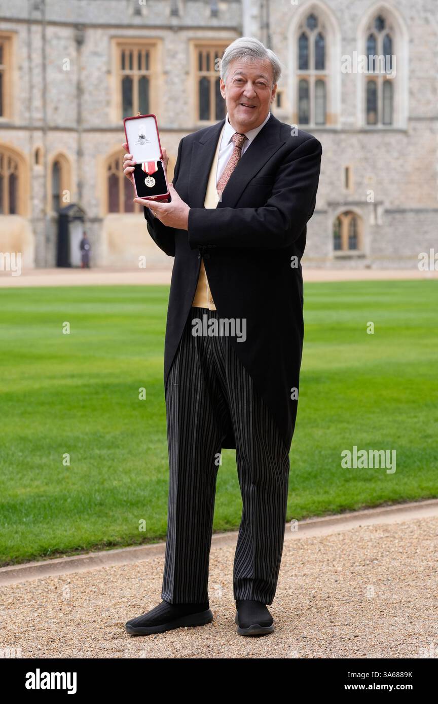 Sir Stephen Fry after being made a Knight Bachelor at an Investiture ceremony at Windsor Castle ...