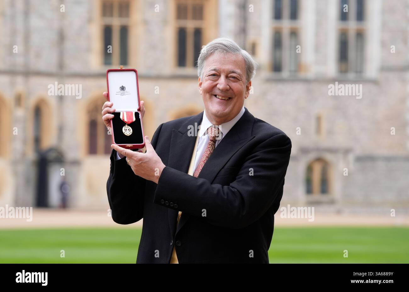 Sir Stephen Fry after being made a Knight Bachelor at an Investiture ...