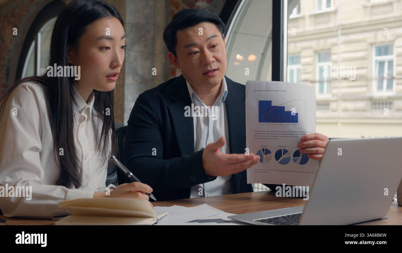 Business video call in office two partners Asian coworkers colleagues ...