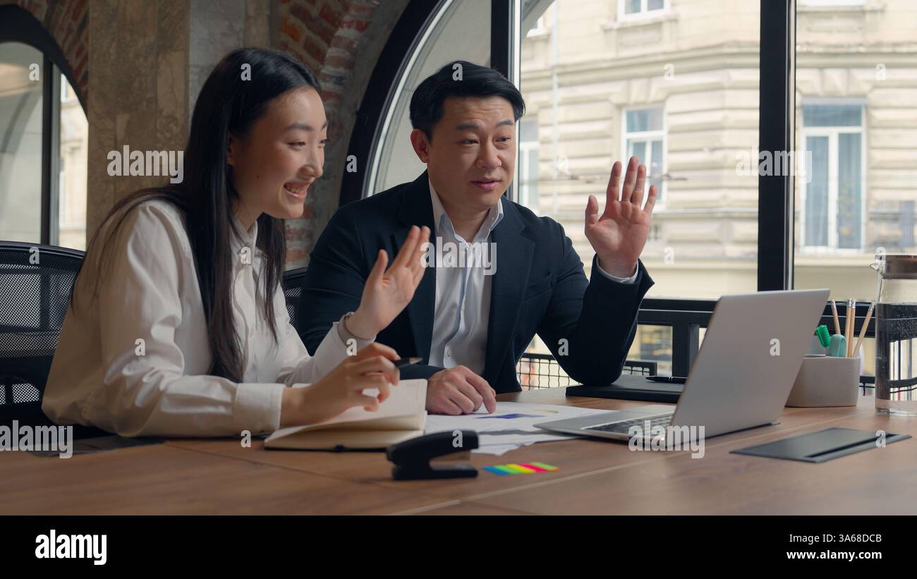 Two Asian business colleagues Korean coworkers Chinese adult middle ...