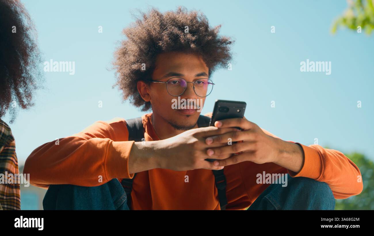 Female male teens addicted smartphones hi-res stock photography and ...