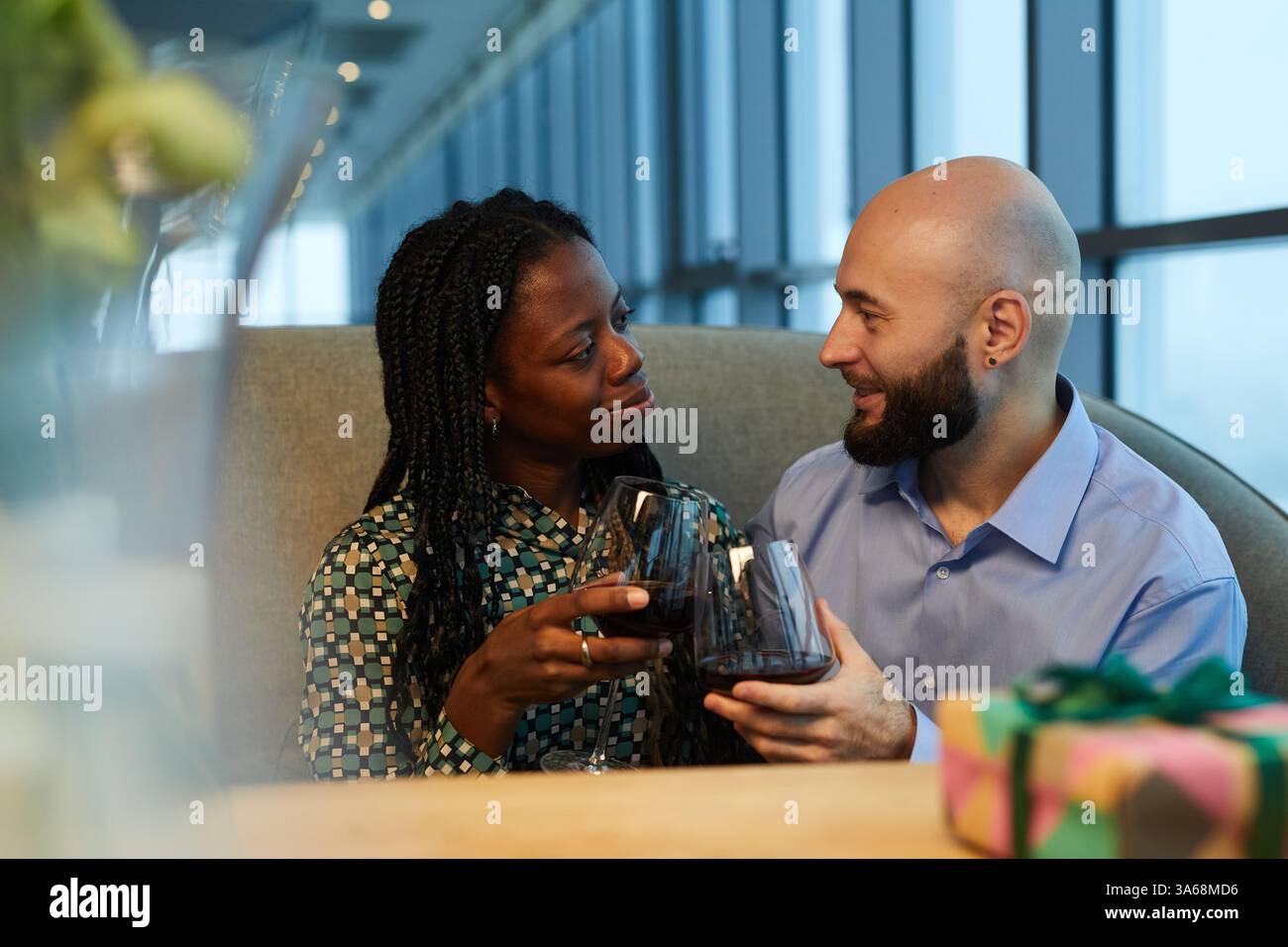 Diverse couple having romantic dinner hi-res stock photography and ...