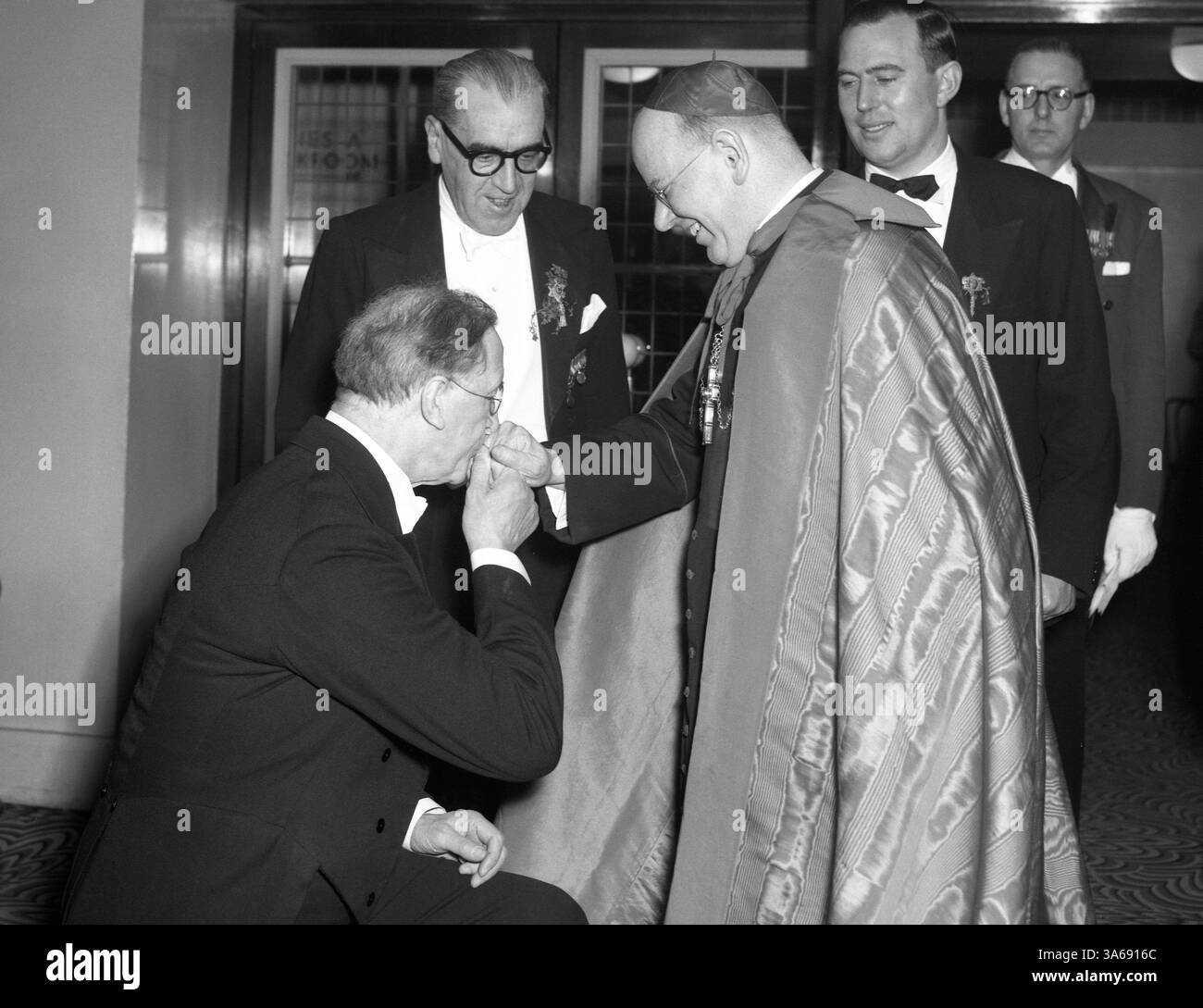 Taoiseach of Ireland, Eamon de Valera, kisses the hand of Roman ...