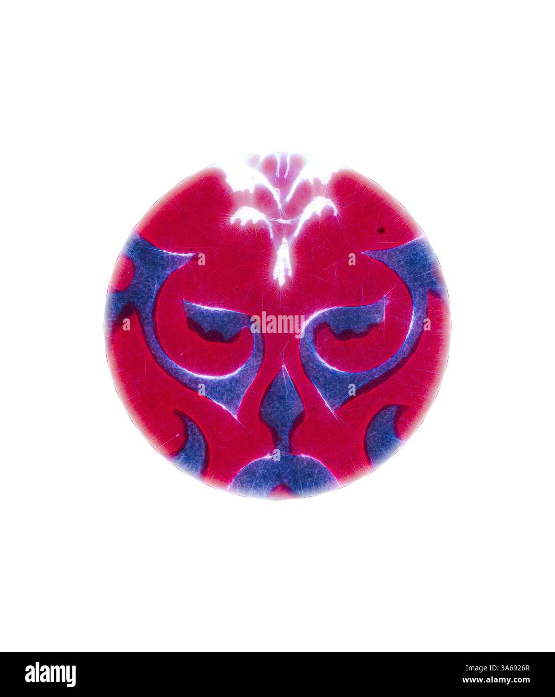 A round object features a striking design of bold red and blue patterns ...