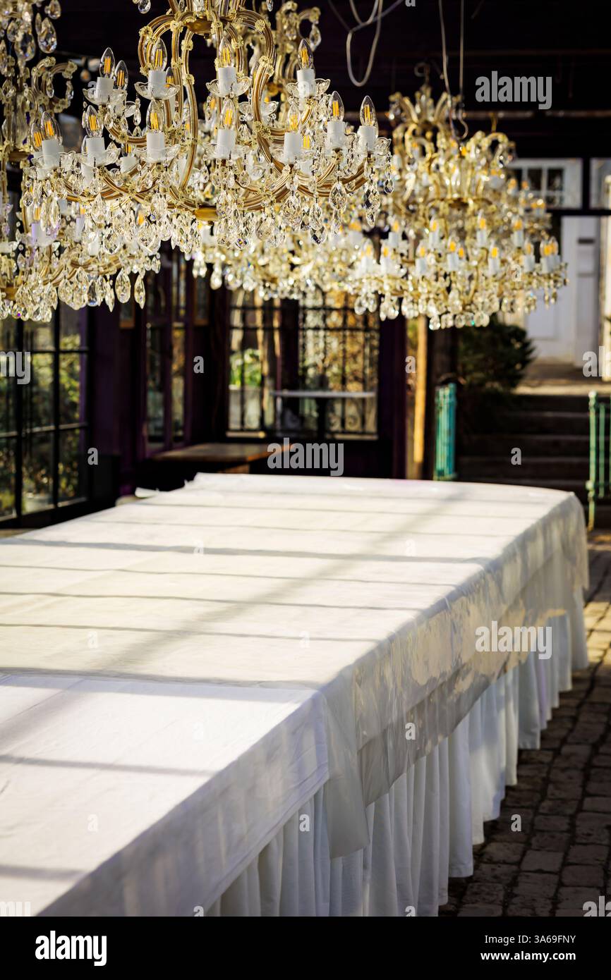 Cozy summer veranda featuring wooden accents, a long table with a white ...
