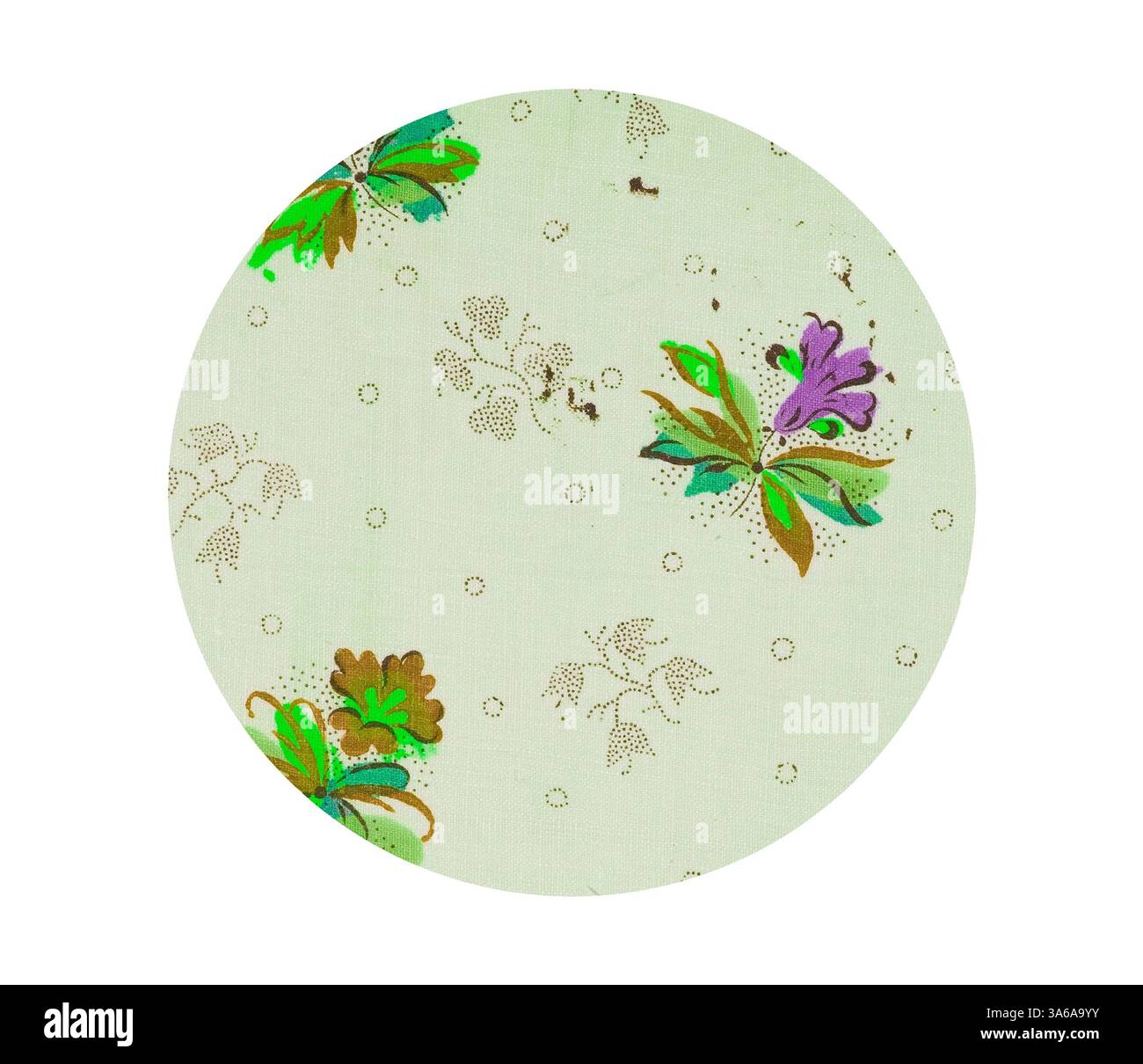 A circular fabric featuring a soft green background adorned with ...