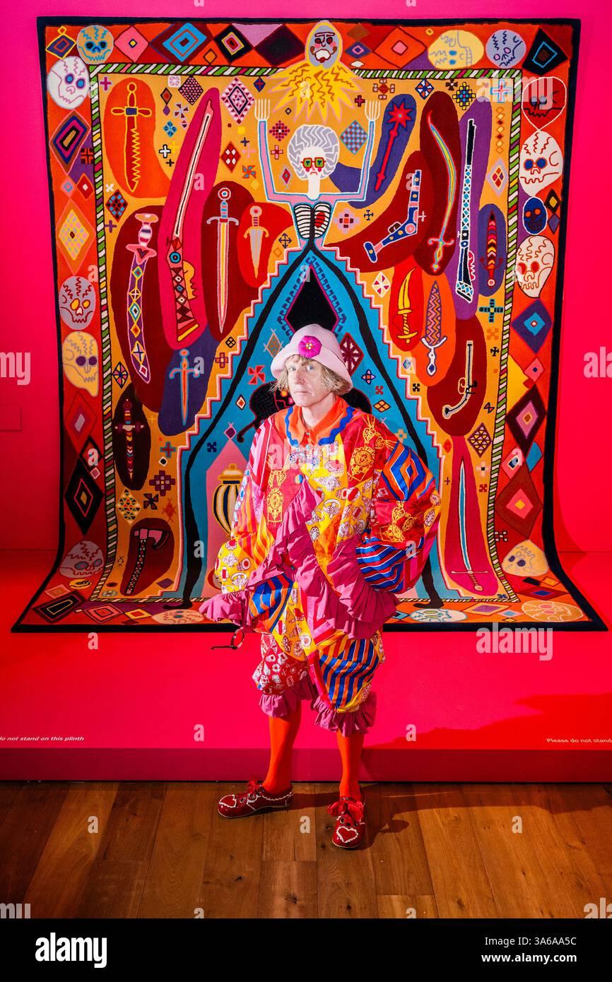 London, UK. 25th Mar, 2025. The artist with Heavens Gate - Grayson ...