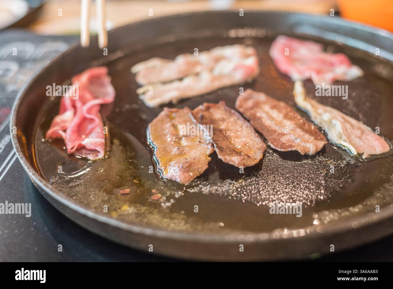 Grilled raw meat beef and pork (barbeque, bbq) a food cooking on wagyu ...