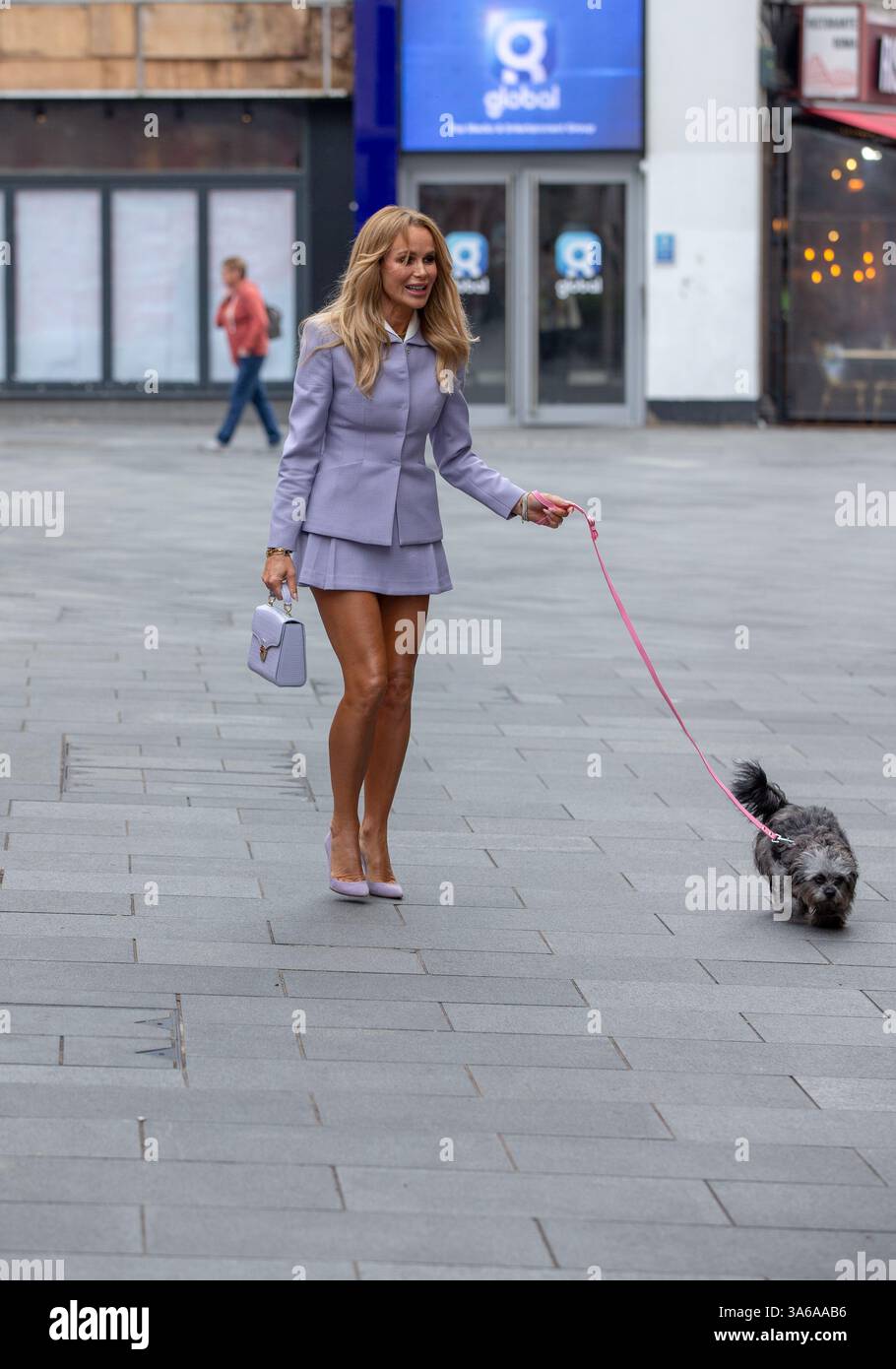 London, England, UK. 25th Mar, 2025. Amanda Holden with her dog Minnie ...