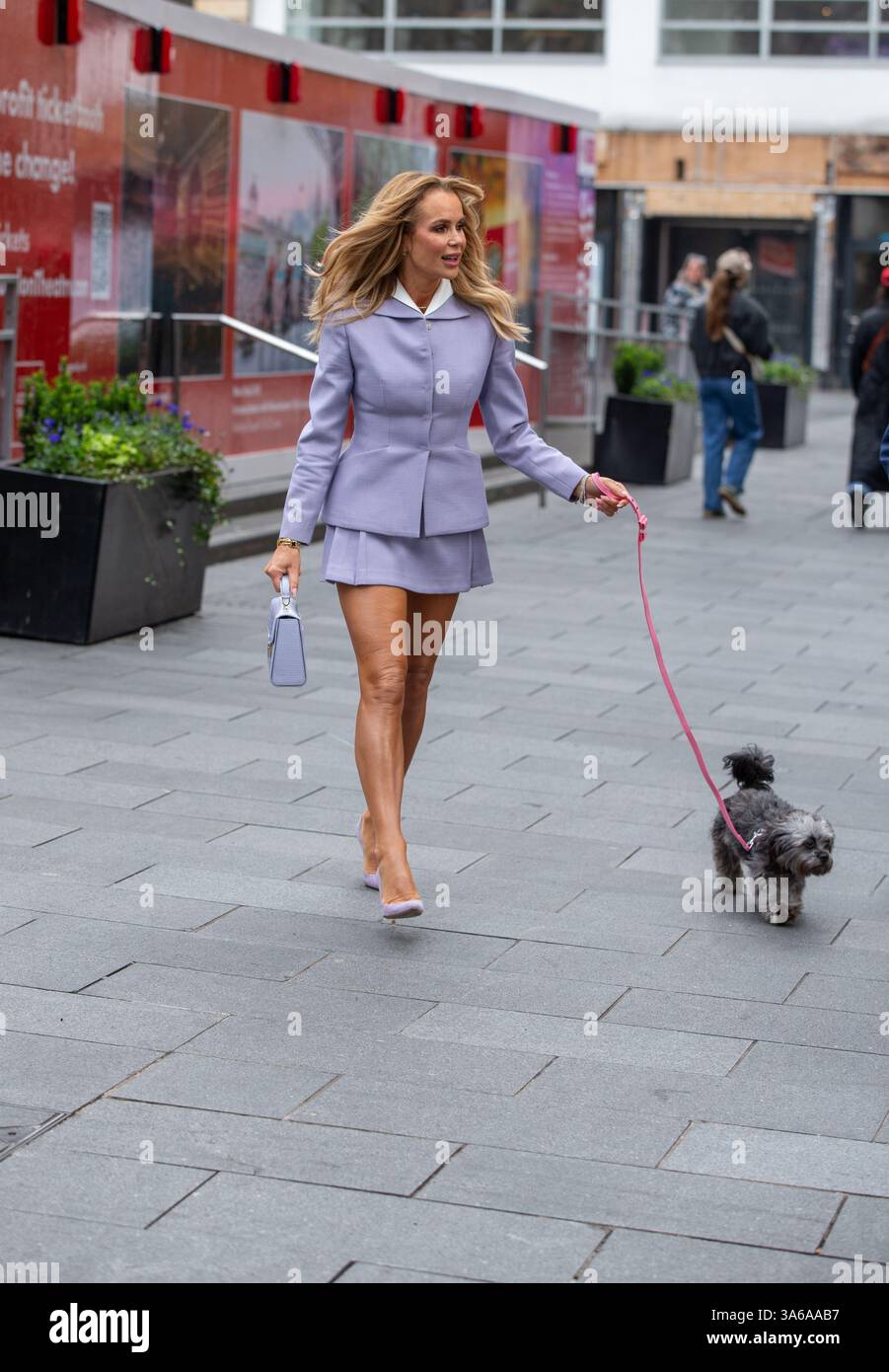 London, England, UK. 25th Mar, 2025. Amanda Holden with her dog Minnie ...