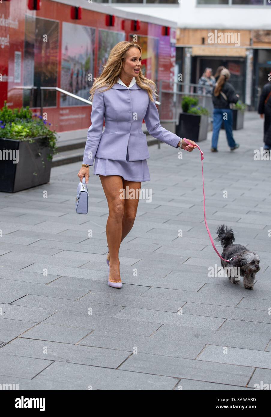 London, England, UK. 25th Mar, 2025. Amanda Holden with her dog Minnie ...