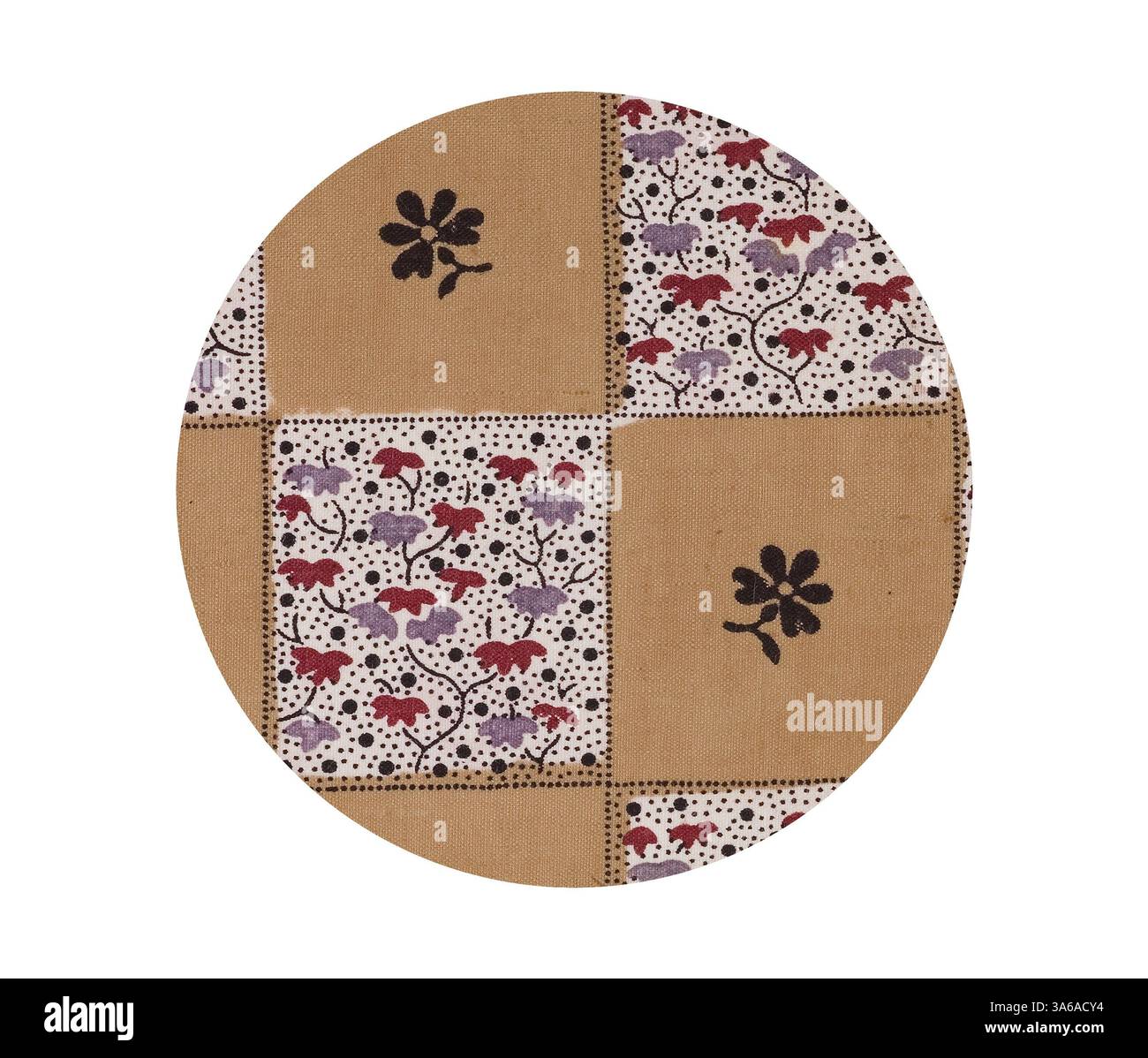 A circular textile featuring a patchwork design with delicate floral ...