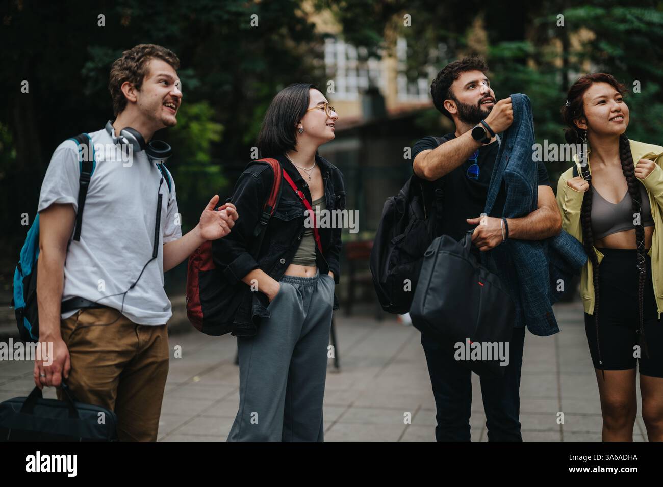 Students enjoying a casual outdoor gathering on campus Stock Photo - Alamy