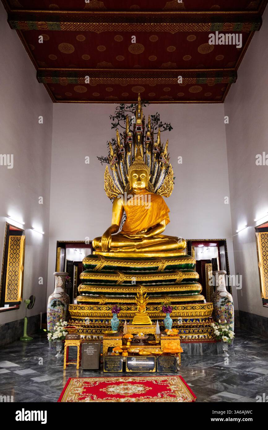 Ancient Buddha meditate and cover head by mythical serpent or Nak Prok ...