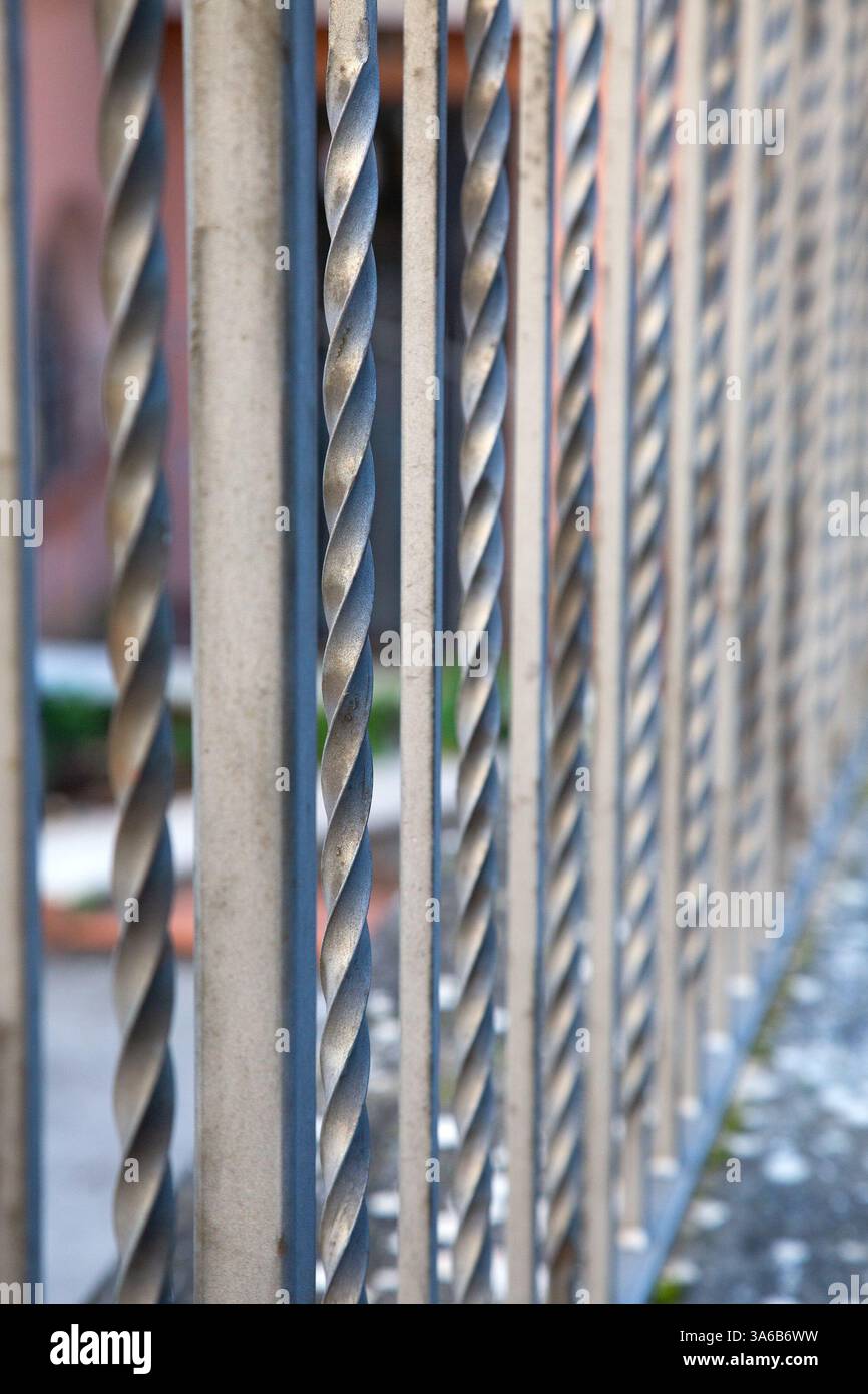 A detailed close up view of a metal fence showcasing its twisted design ...