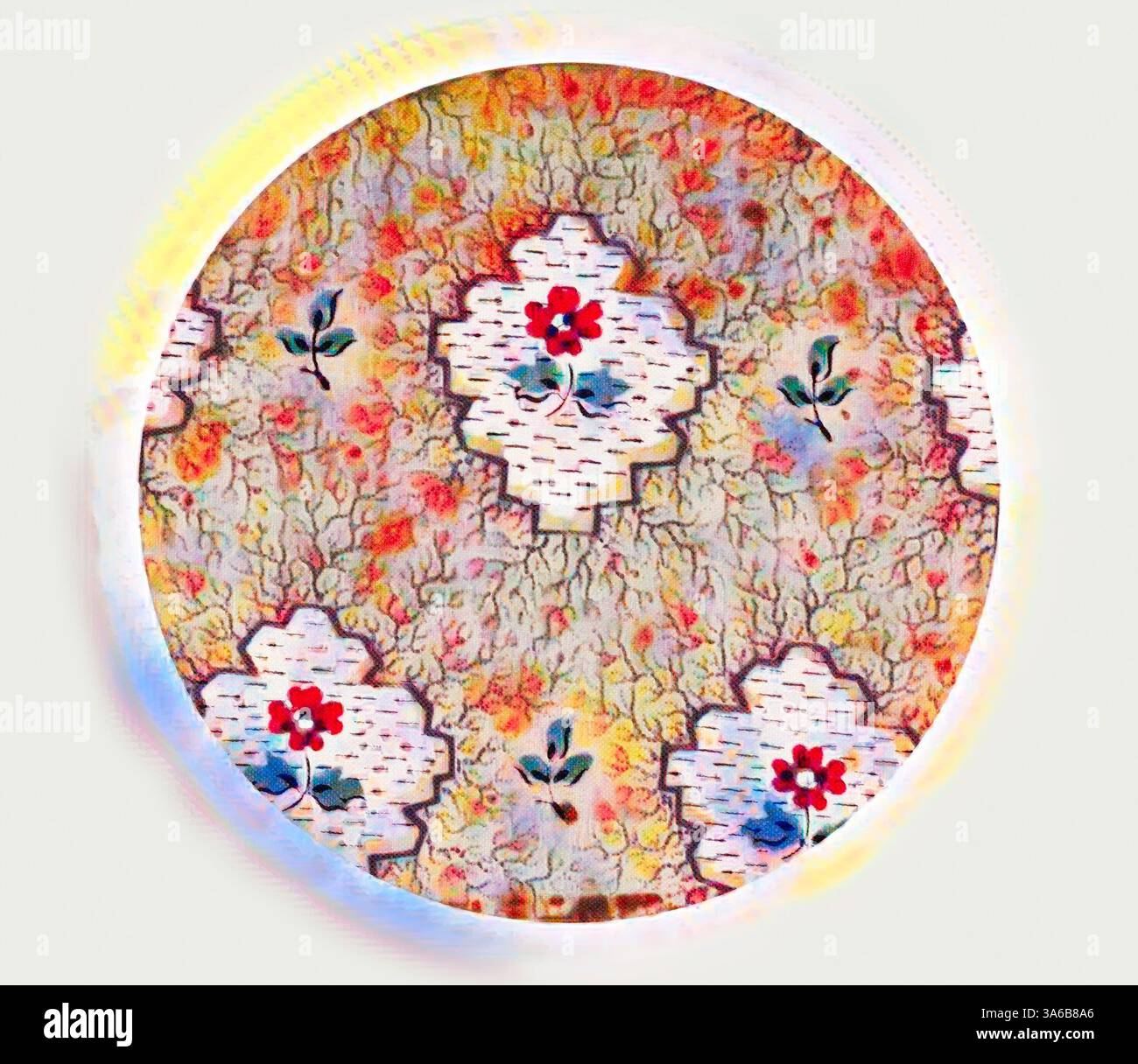A round decorative plate features an intricate floral pattern with ...