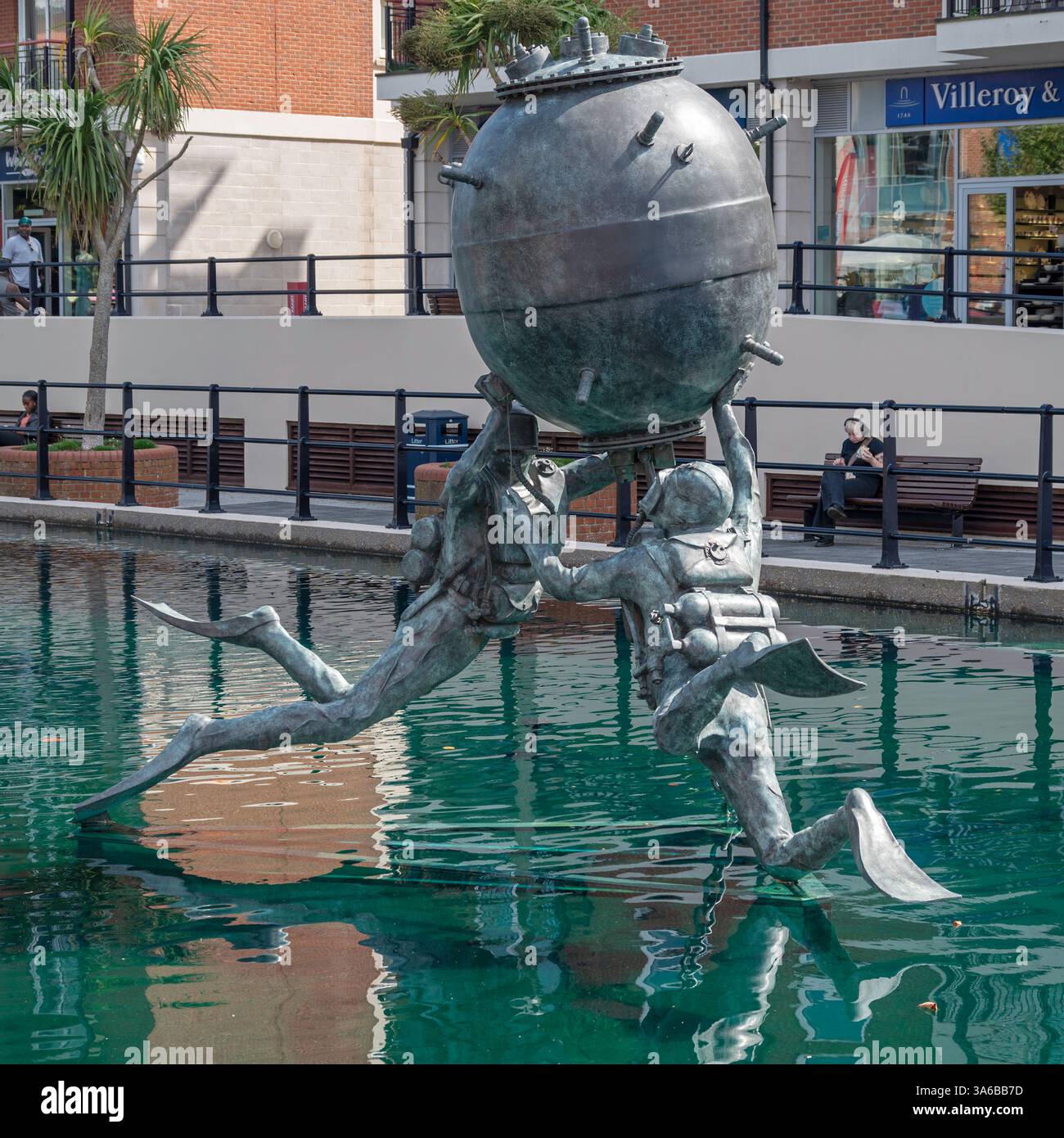 Bronze statue of two bomb and mine disposal divers with a British Mk 17 ...