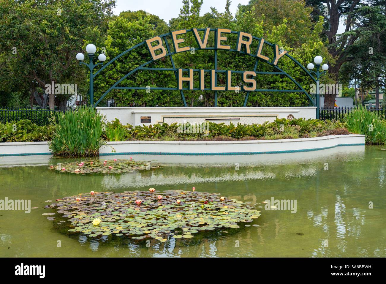 A peaceful pond with lily pads and a sign saying Beverly Hills in Los ...