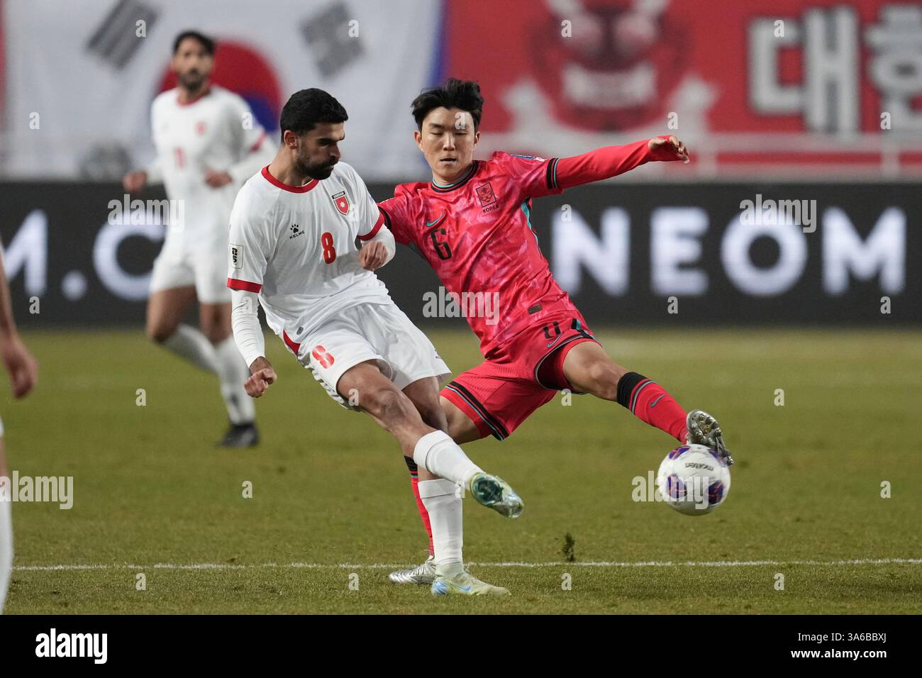 Jordan's Nizar Al Rashdan, left, and South Korea's Hwang In-beom, right ...