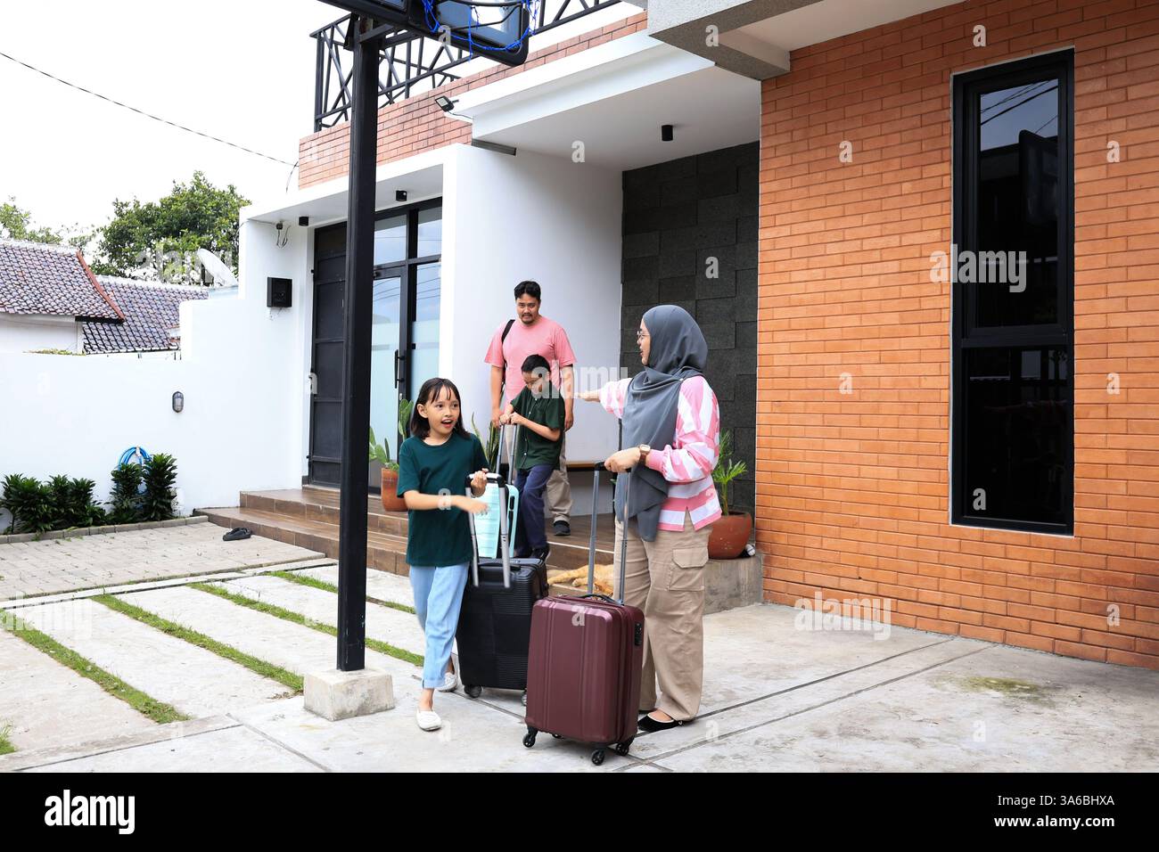 Asian Muslim Family with Kids Going on Mudik Road Trip Back Home During Eid Mubarak Celebration ...