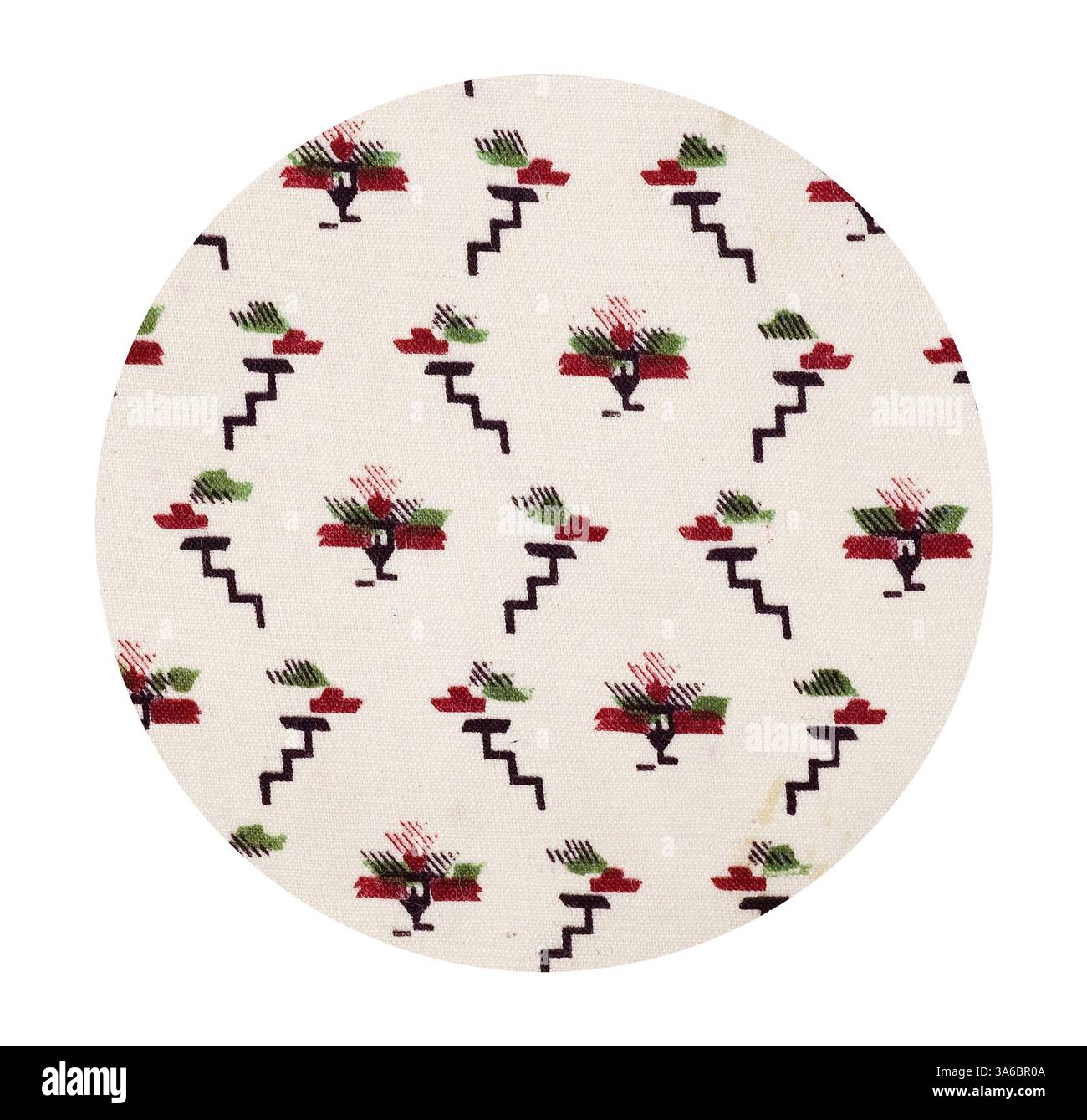 A patterned fabric featuring a repetitive design of stylized plants and ...