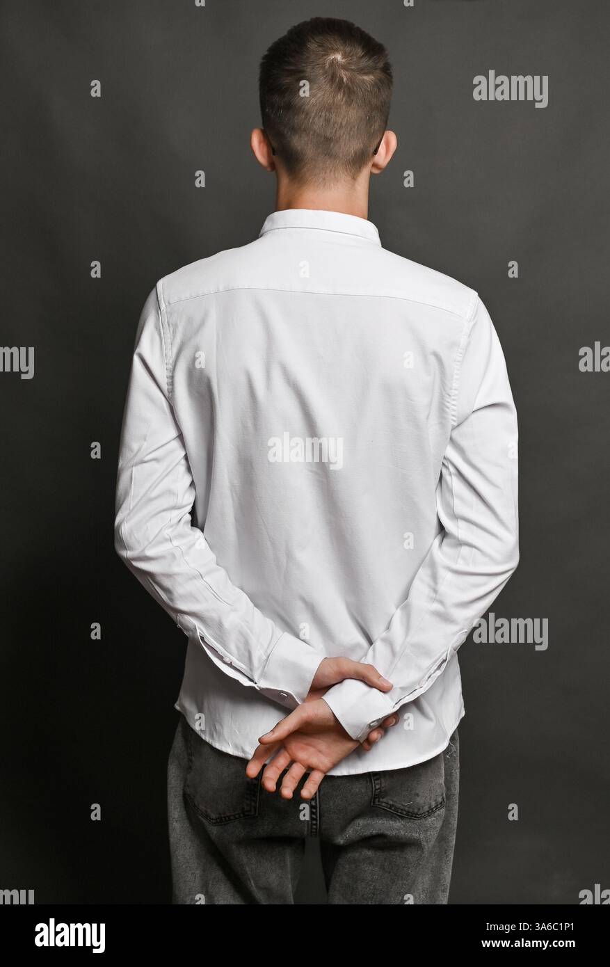 With hands clasped behind his back hi-res stock photography and images ...