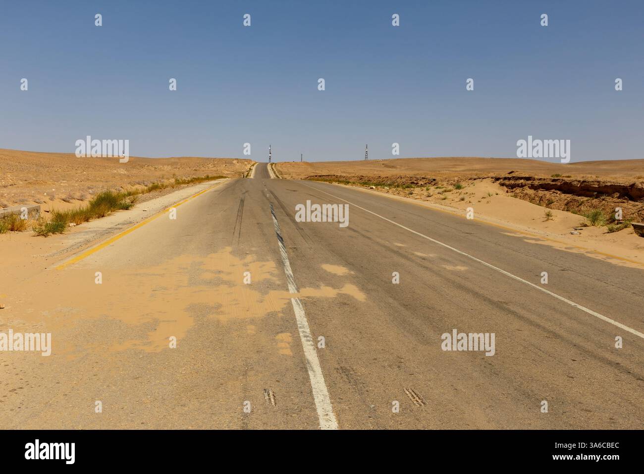 Asphalt road between Kunduz and Kholm in Afghanistan under clear blue ...