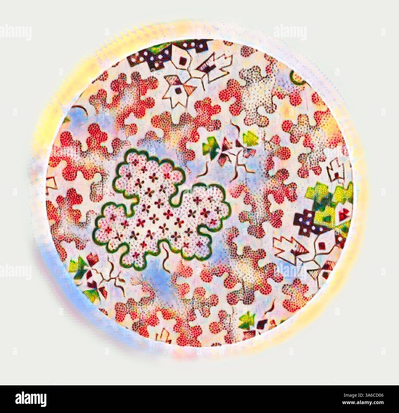 A circular textile with a vibrant floral pattern featuring clusters of ...