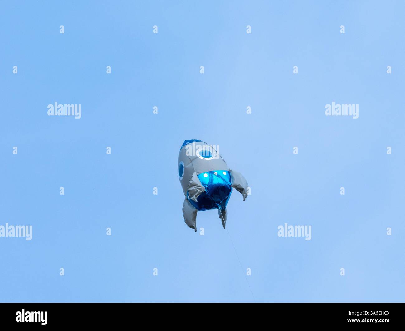rocket shaped balloon against a sky background Stock Photo - Alamy