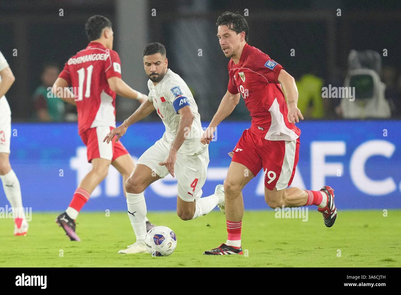Indonesia's Thom Haye, right, competes for the ball against Bahrain's ...
