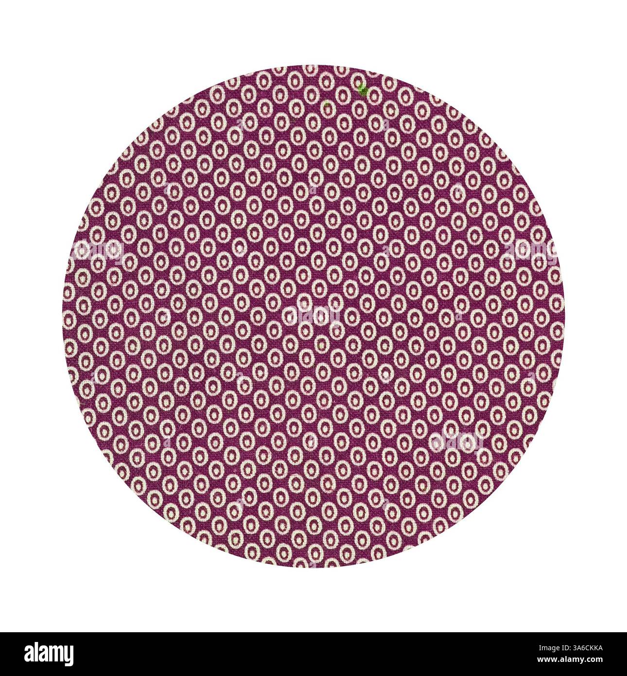 A circular textile pattern featuring an intricate design of small ovals ...