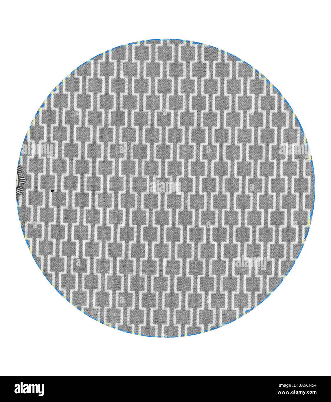 A circular fabric with a geometric pattern featuring repeated ...