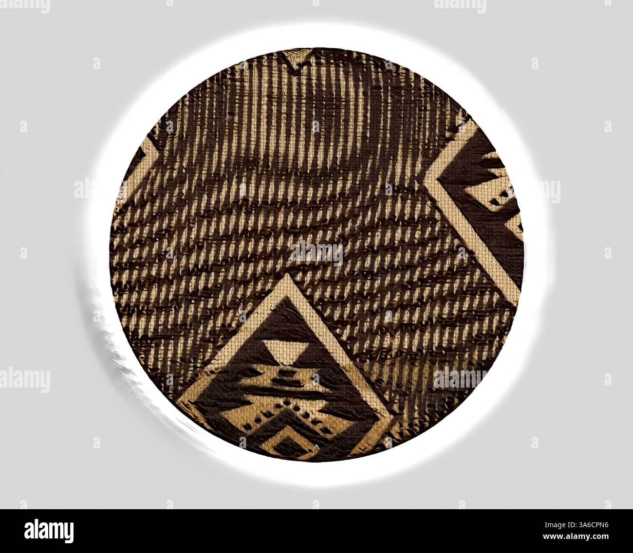 A textured fabric featuring intricate geometric patterns in earthy ...