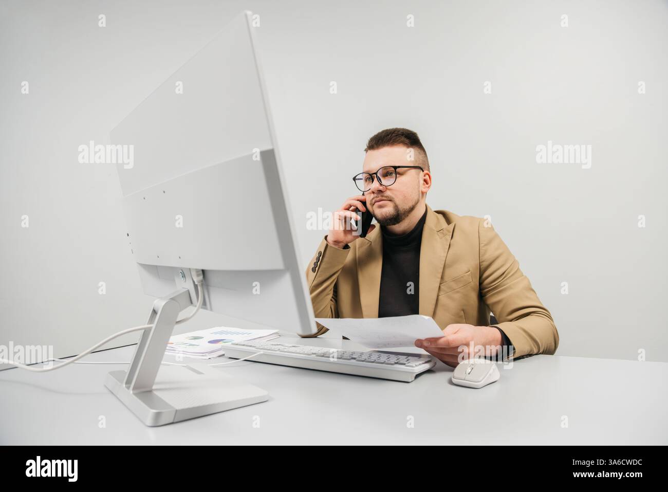 Male receptionist meeting client in office hi-res stock photography and ...