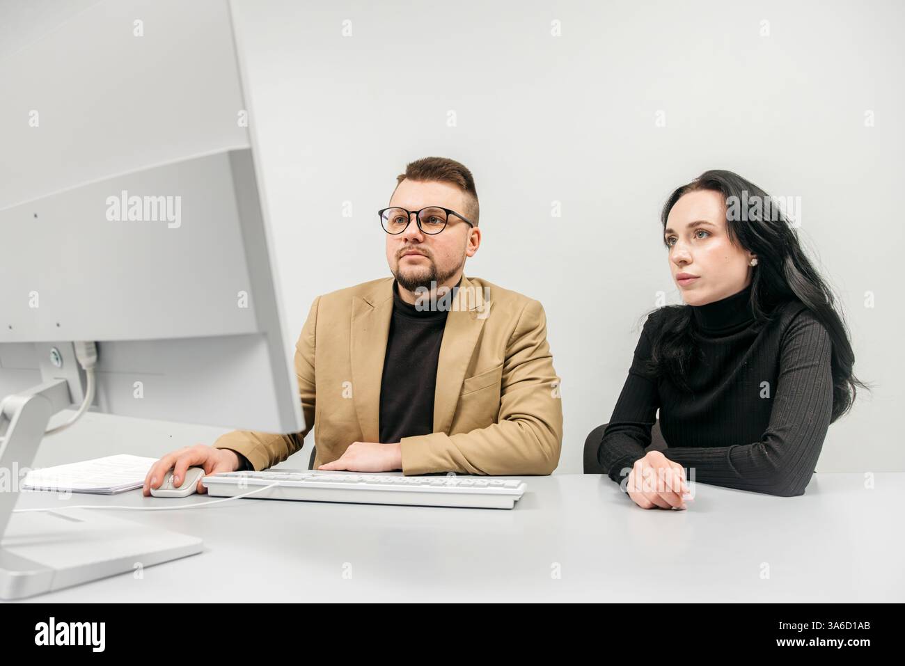 Office employees brainstorm, analyzing charts in a modern, bright ...