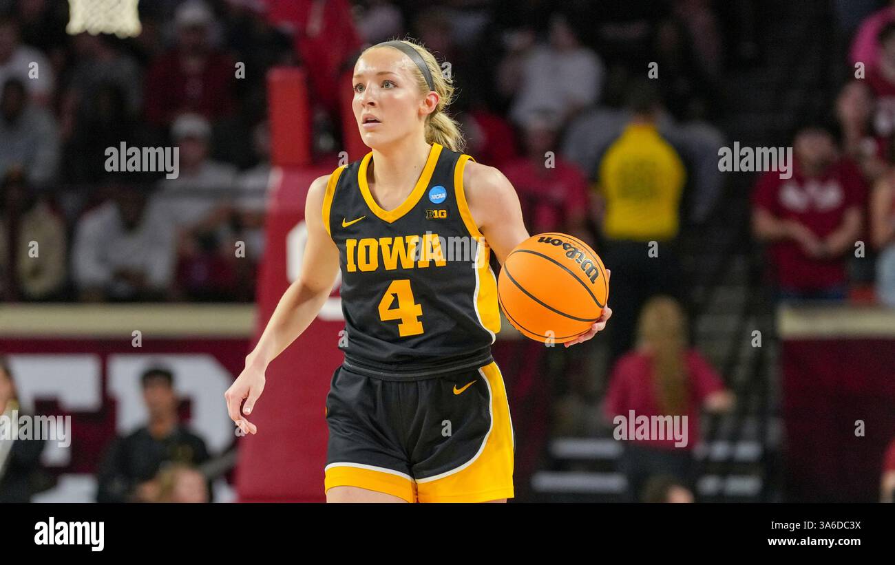 Iowa guard Kylie Feuerbach pushes down the court during the first half ...