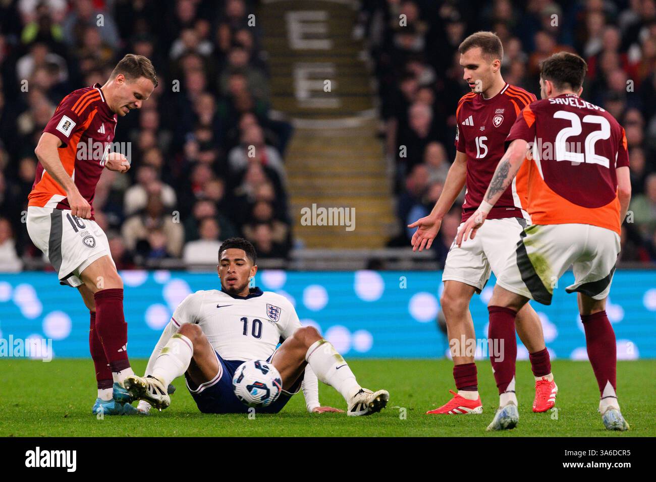 LONDON, ENGLAND - Alvis Jaunzems of Latvia and Jude Bellingham of England and Dmitrijs Zelenkovs ...