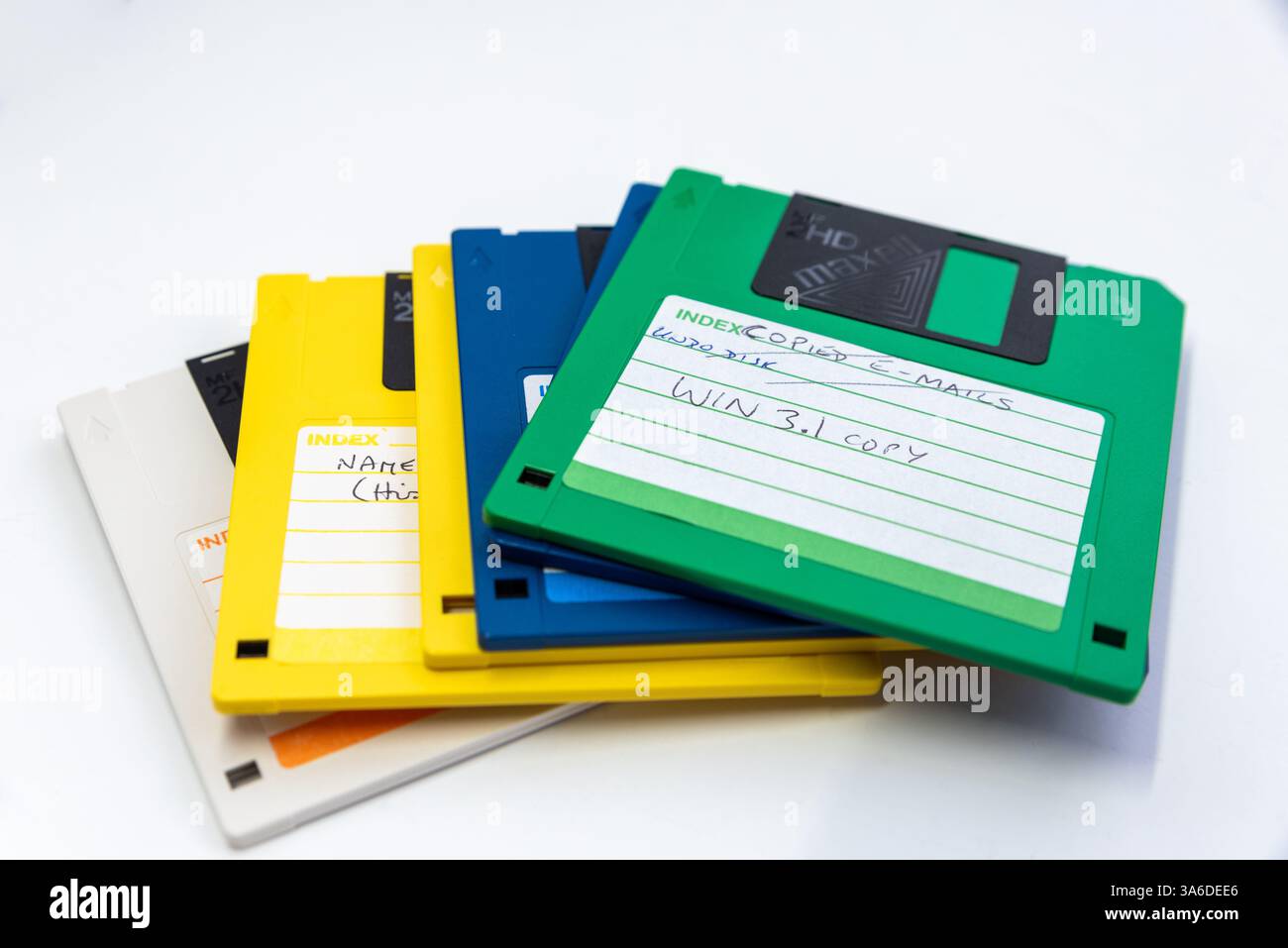 Floppy disk stack. One with a copy of Microsoft Windows 3.1 hand ...