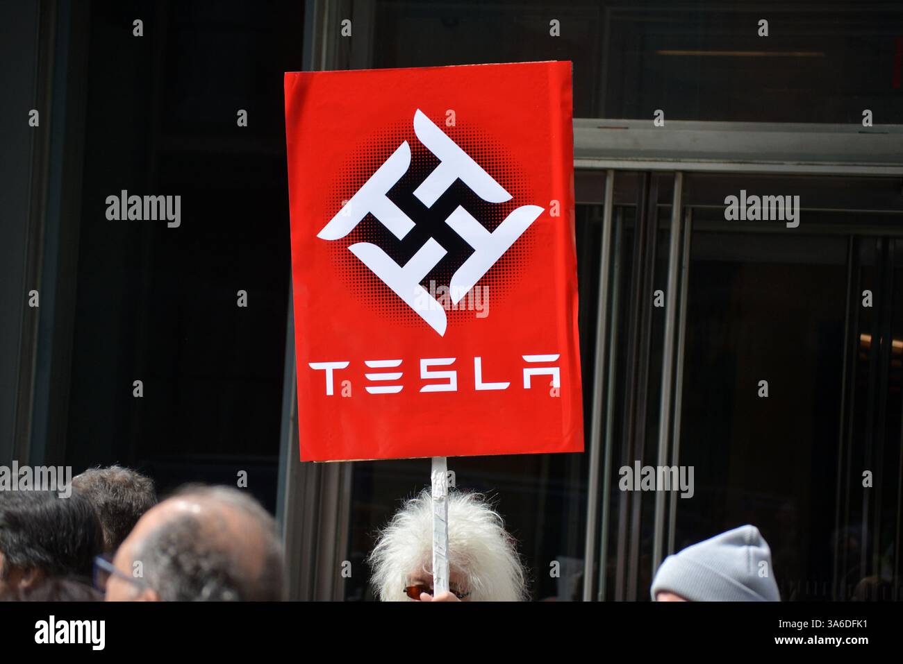Tesla Takedown rally against Elon Musk and DOGE in front of a Tesla ...