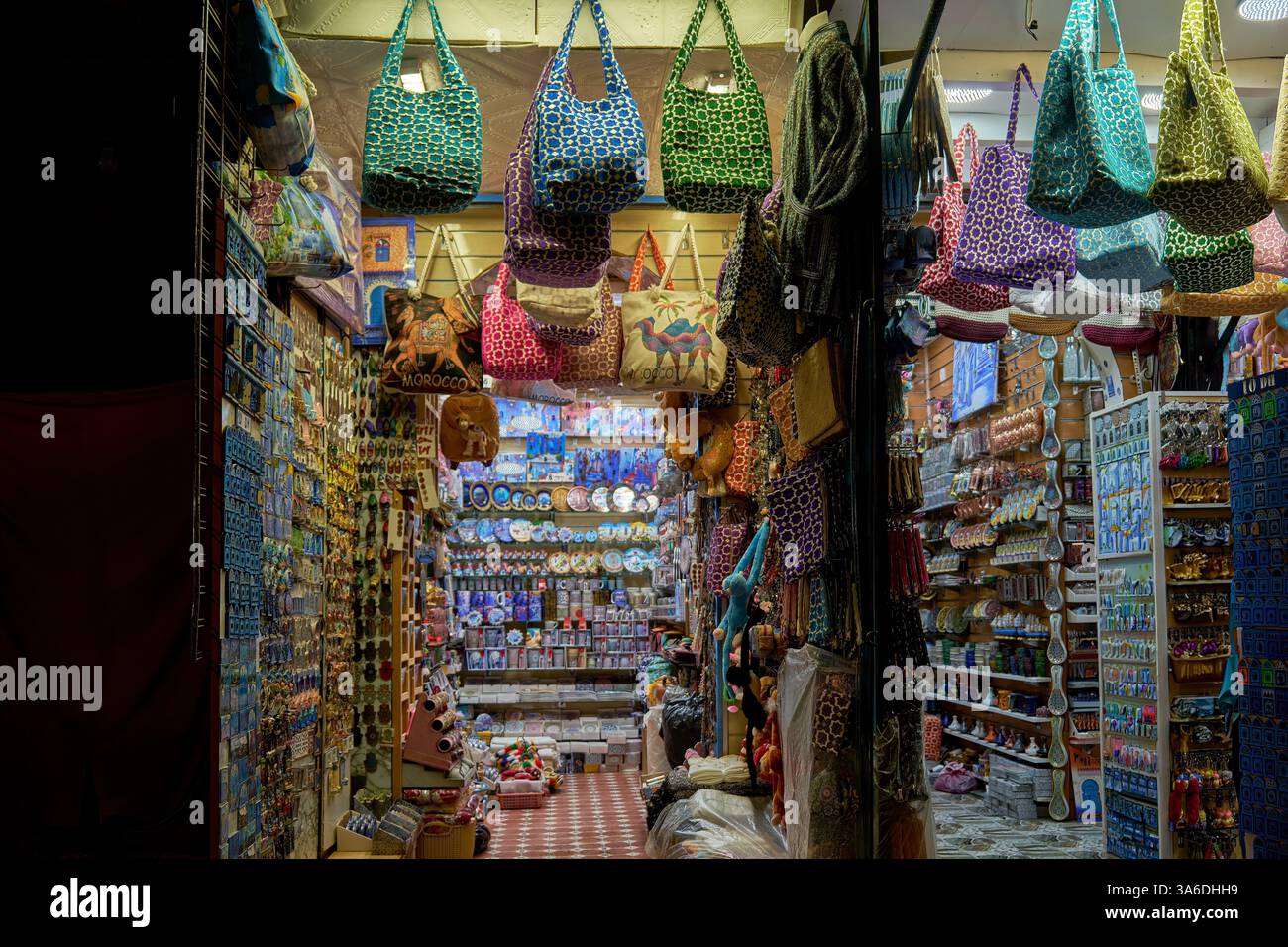 Souvenirs stall selling ladies purses, handbags, fridge magnets, cups ...