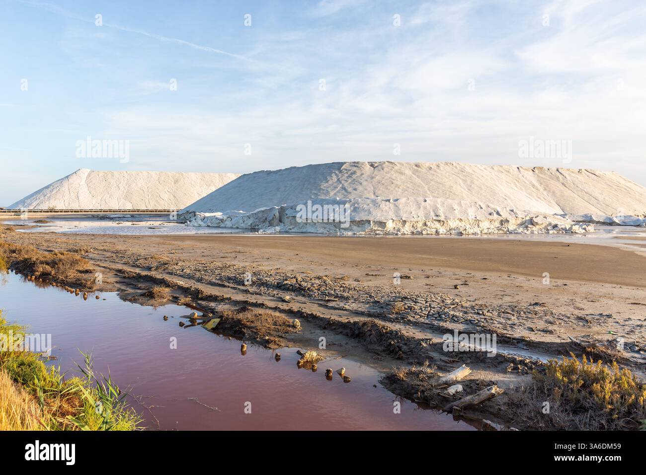 Under the late afternoon light, mounds of raw sea salt extracted from ...