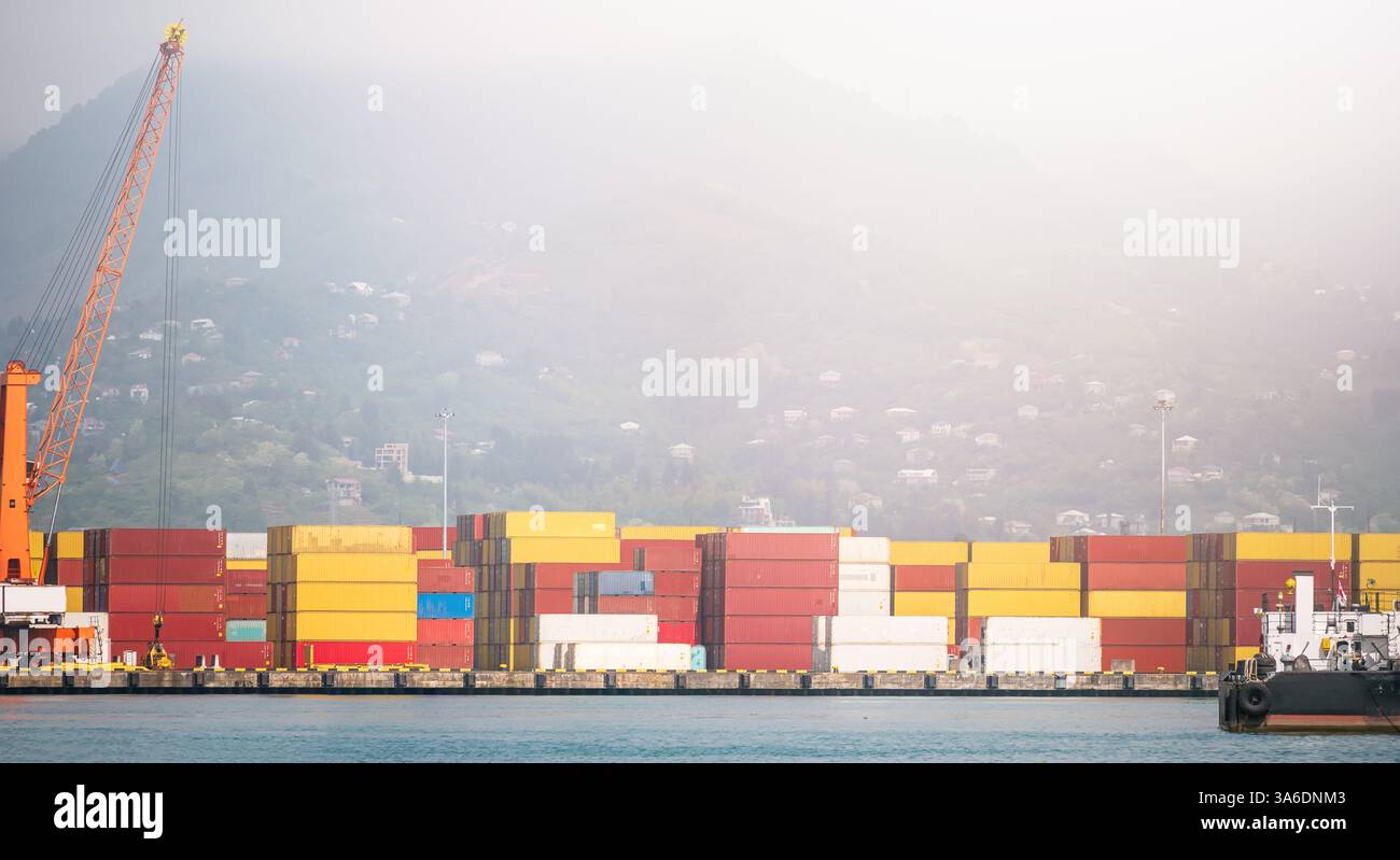 International cargo port with stacked shipping containers, freight ...