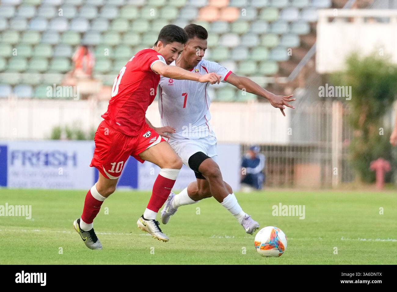 Afghanistan's Rahman Akbari, left, and Myanmar's Lwin Moe Aung in ...