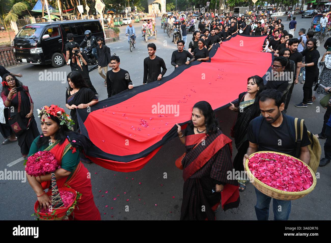 Members of the Prachyanat School of Acting and Design join the annual Lal Jatra procession and ...